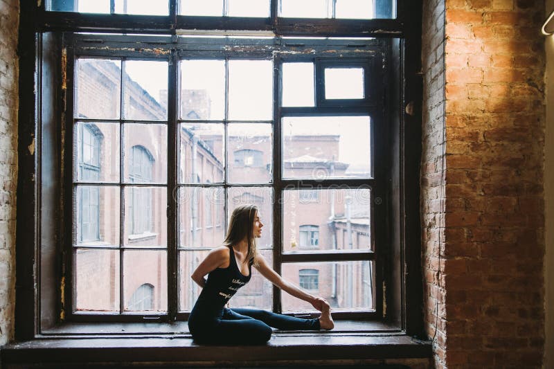 Woman Stretching Beside Window Stock Photo - Image of inside, indoors ...