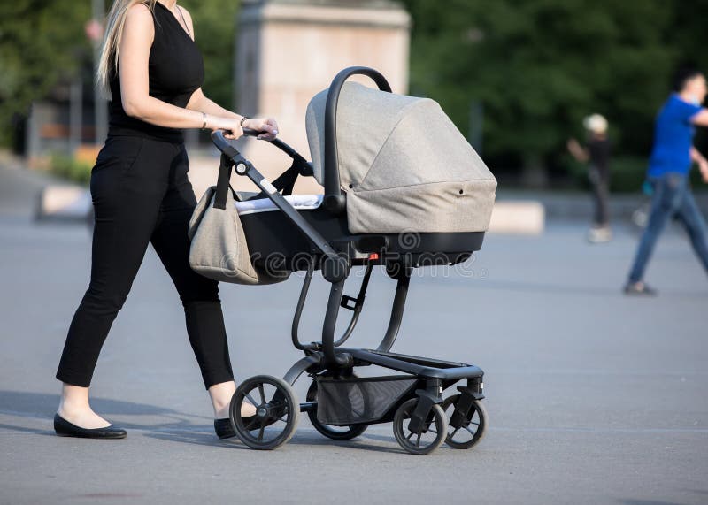 Woman with Stroller Walking Stock Photo - Image of pram, park: 212892720