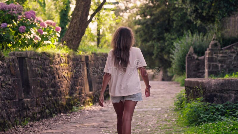 Woman Walking Down Path in Park Stock Footage - Video of foliage ...
