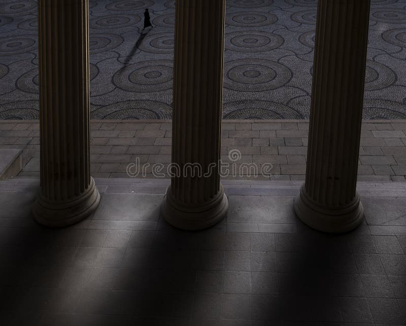 Woman Strolling among Pillars during Sunset Stock Image - Image of ...