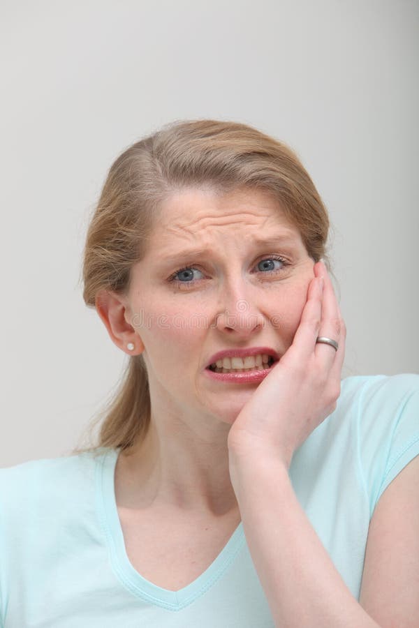 Woman struggles with pain stock image. Image of anguished - 24296403