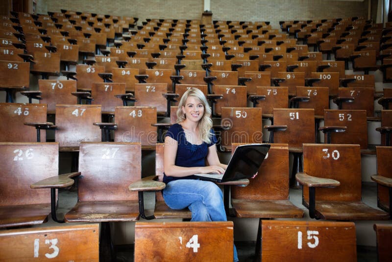 Woman Student in Empty Lecture Hall Stock Photo - Image of hall, book ...