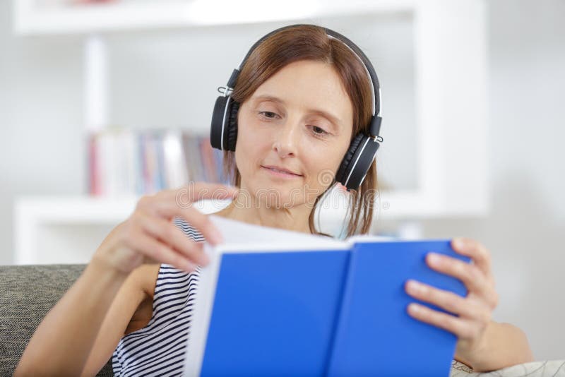 Woman Studying with Book and Headphones Stock Image - Image of woman ...