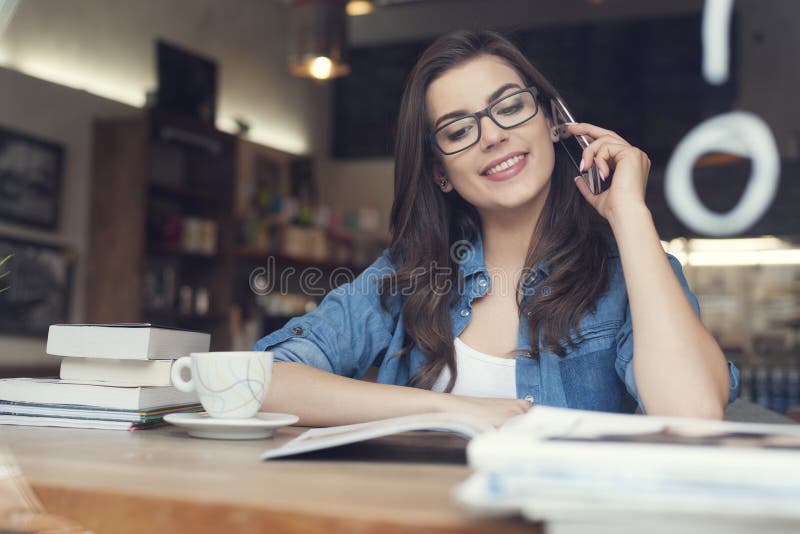Woman studying in cafe stock photo. Image of discussion - 40675070