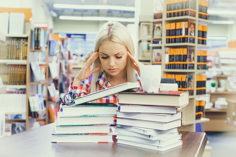 Woman studying in library stock photo. Image of book - 62228780