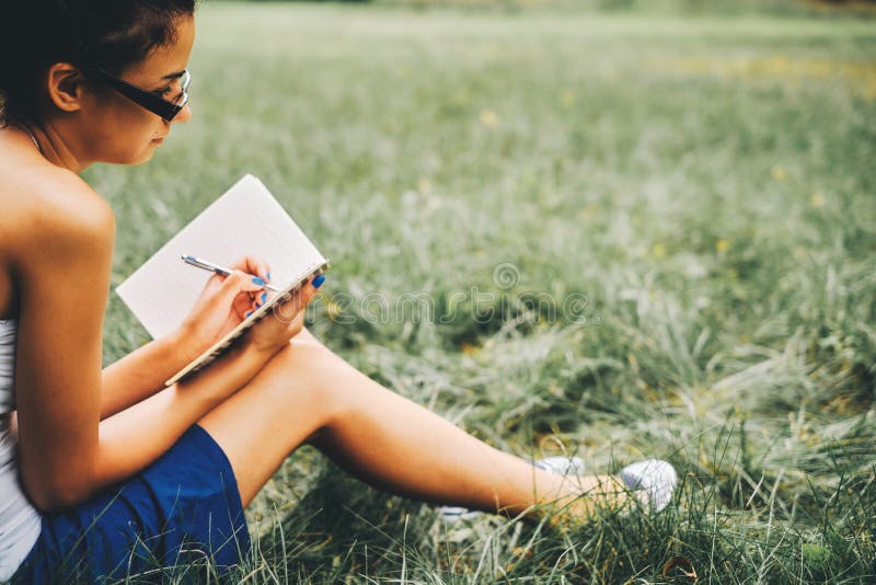 Woman studying outdoor stock photo. Image of bench, brunette - 123344578