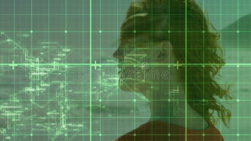 Woman Studying Technical Schematics in Tech Lab, with Green Grid ...