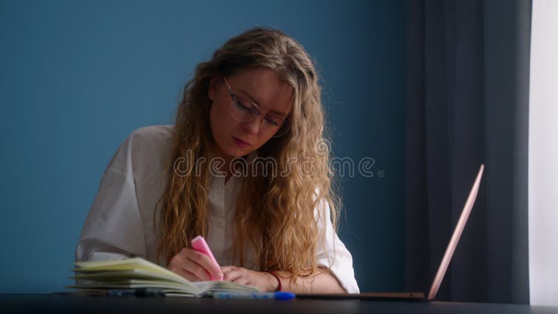 Woman Studying, Writing Notes To Notepad, Listens To Web Class Tutorial ...