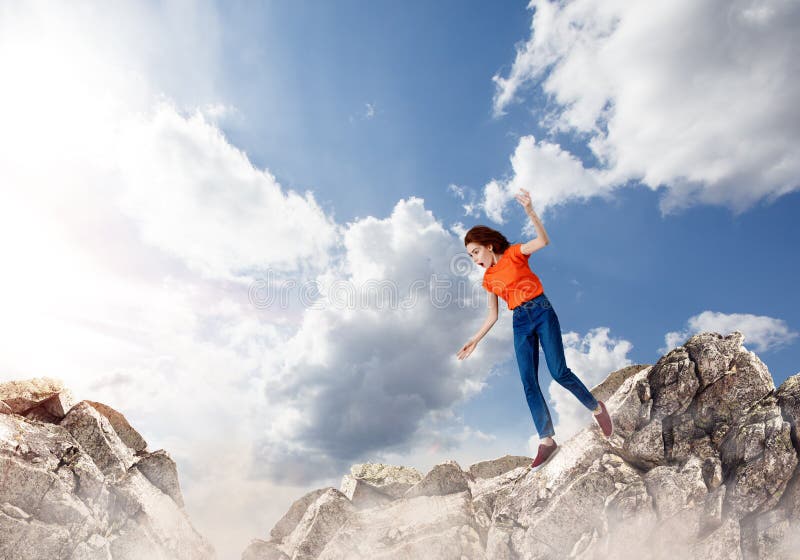 Woman Stumbled on the Rocks and Going To Falls Down. Stock Photo ...