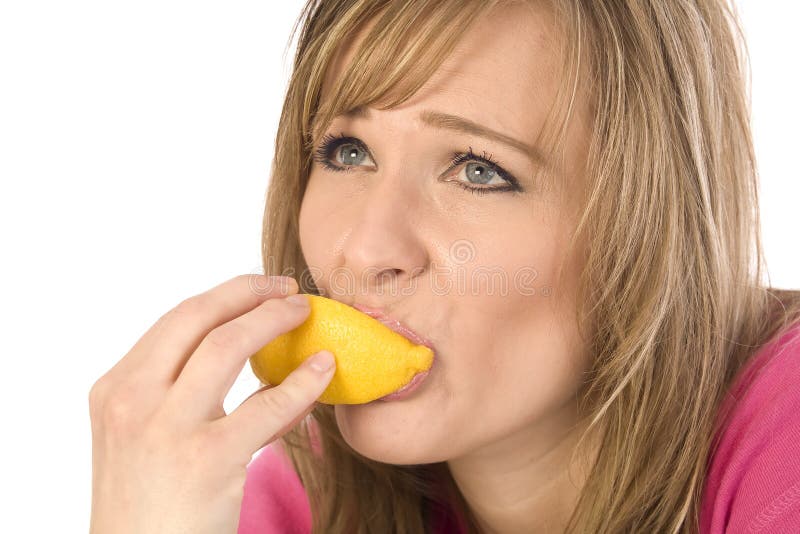 Woman sucking on a lemon stock photo. Image of squeeze - 13558790