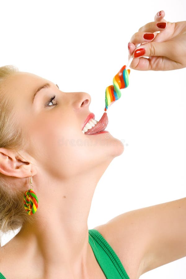 Woman sucking a lollipop stock image. Image of girl, attractive - 51611073