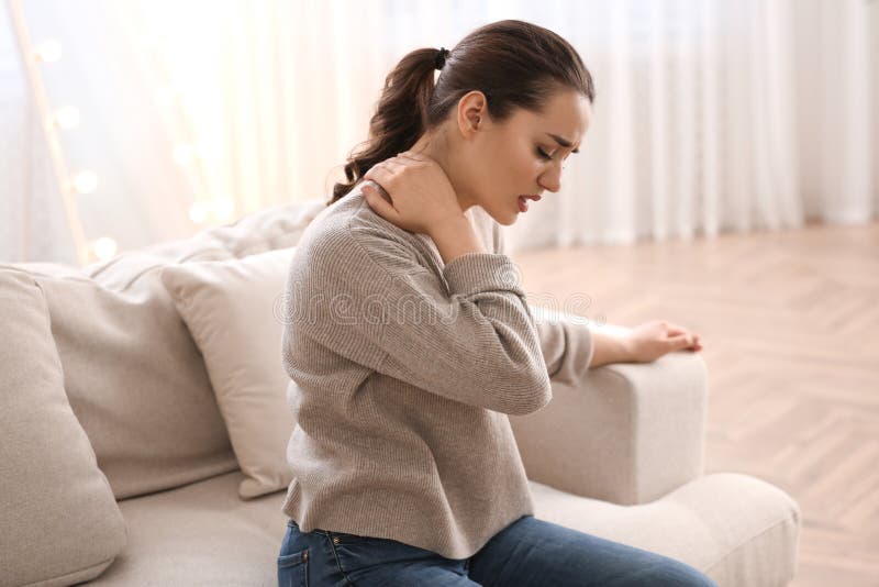 Woman Suffering from Neck Pain at Home. Bad Posture Problem Stock Image ...