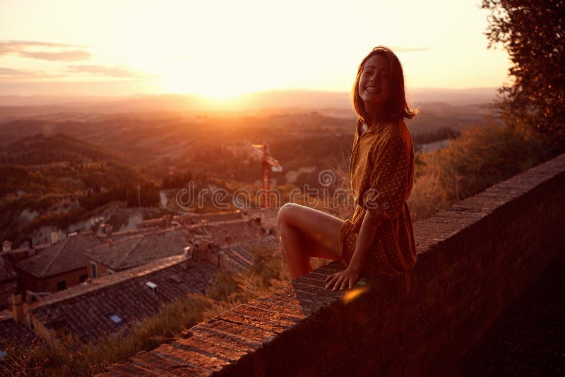 Woman at Sunset. Smiling Woman is Enjoying Sunset Stock Image - Image ...