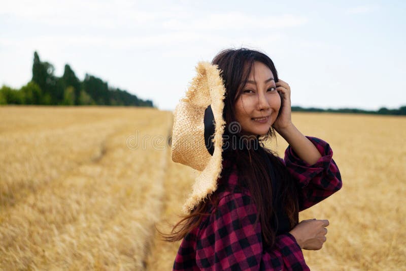 Woman at Sunset in Yellow Wheat in Straw Hat. Stock Photo - Image of ...