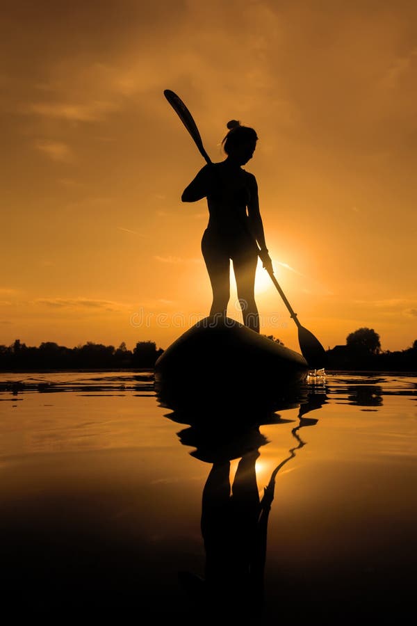 Woman on Sup Board, Paddle Boarding at Sunset Reflection Stock Photo ...