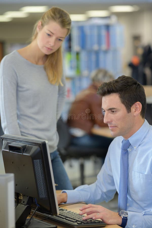 Woman supervising man stock image. Image of hand, person - 78497407