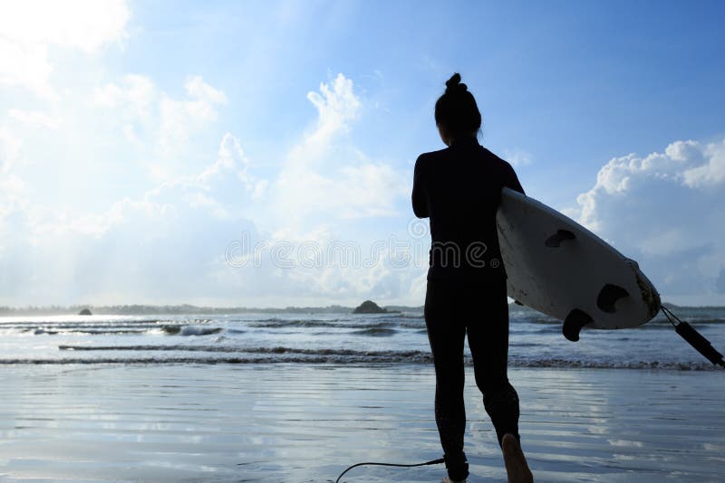 Woman Surfer with White Surfboard Walking Stock Photo - Image of guard ...
