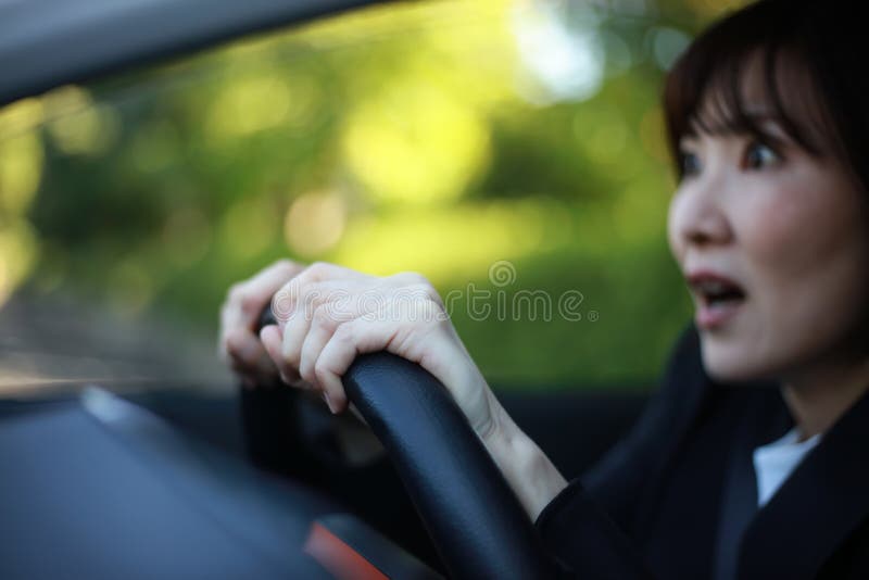 A Woman with a Surprised Expression while Driving Stock Photo - Image ...