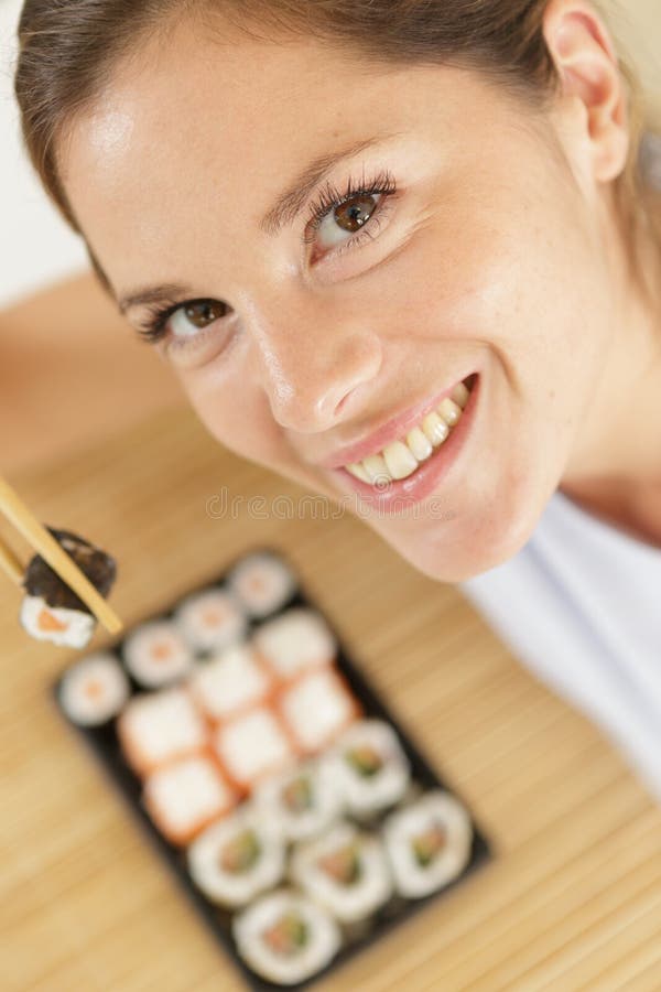Woman with Sushi Looking at Camera Stock Image - Image of healthy ...