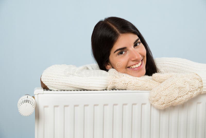 Woman in Sweater Leaning on Radiator Stock Image - Image of cheerful ...