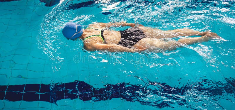 Woman Swimming with Swimming Hat in Swimming Pool Stock Image - Image ...