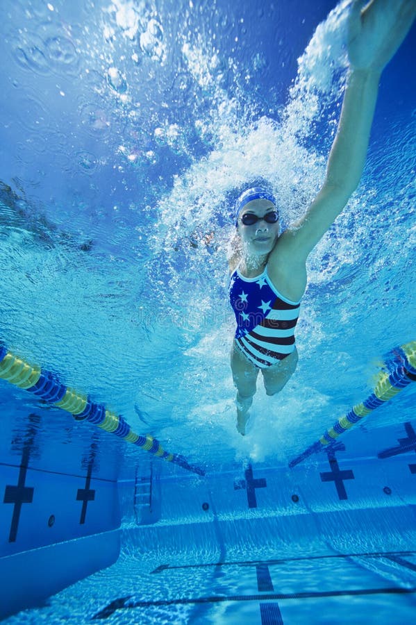 Woman swimming underwater stock image. Image of underwater - 13585323