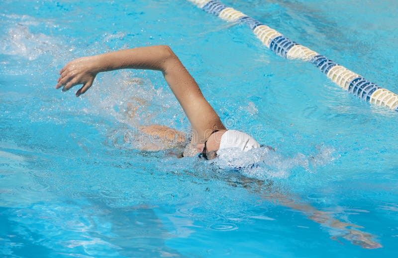 Young Beautiful Woman With Swimsuit Swimming On A Blue Water Pool Stock