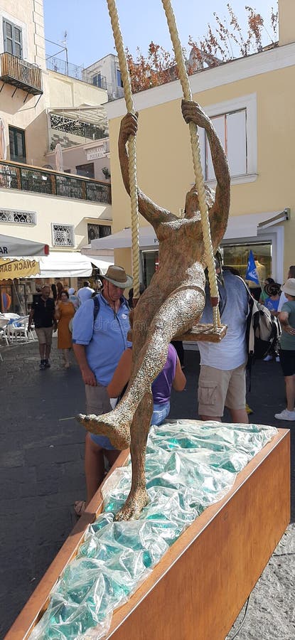Woman on a Swing in the Middle of a Square in Capri Editorial Stock ...