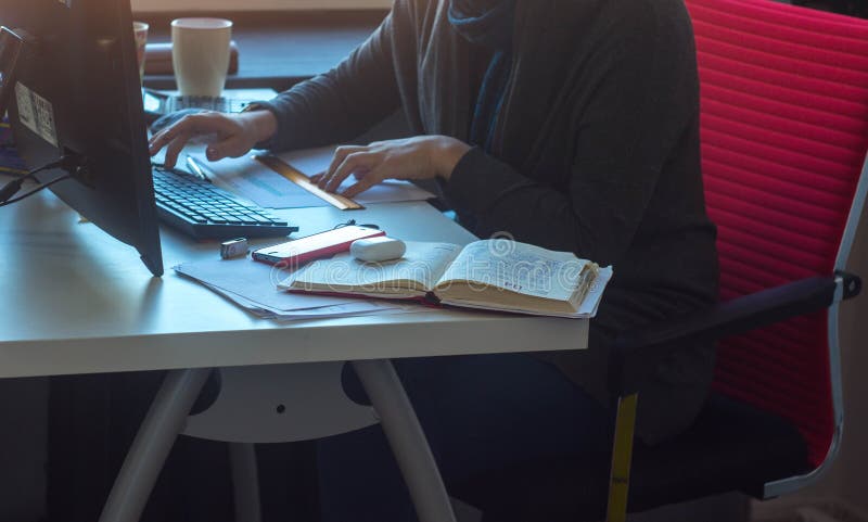 A Woman at the Table Working at the Computer Stock Photo - Image of ...