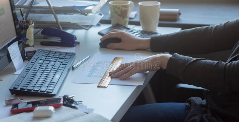 A Woman at the Table Working at the Computer Stock Photo - Image of ...