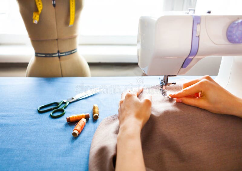 Woman Tailor Working on Sewing Machine. Hands. Close Up. Tailoring ...
