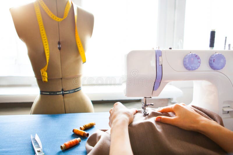 Woman Tailor Working on Sewing Machine. Hands. Close Up. Tailoring ...