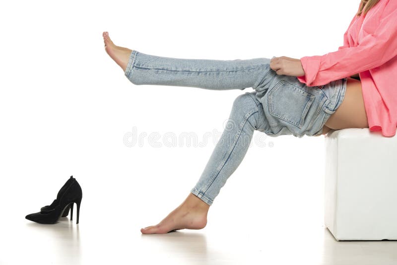 Woman Take Off Her Jeans on White Stock Photo - Image of studio, blue ...