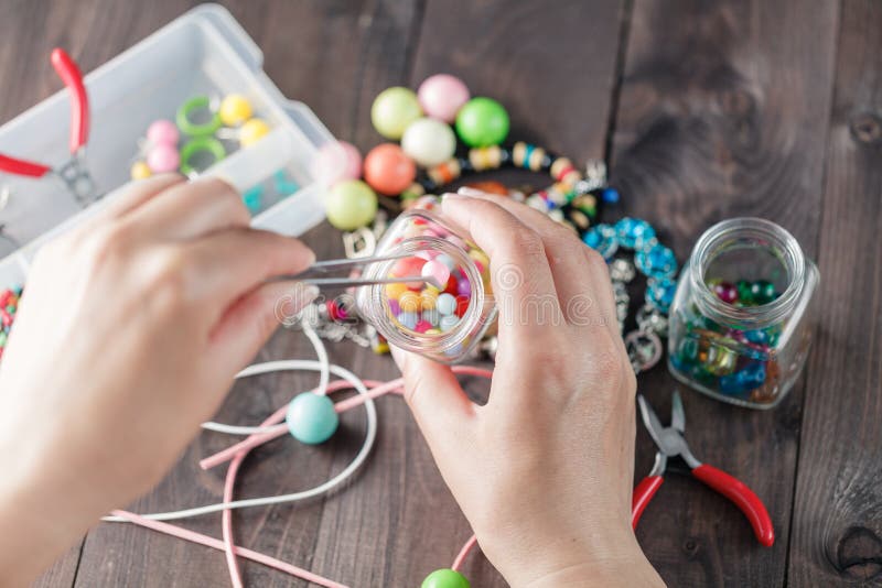 Woman take one bead stock photo. Image of arms, enthusiasm - 72959952