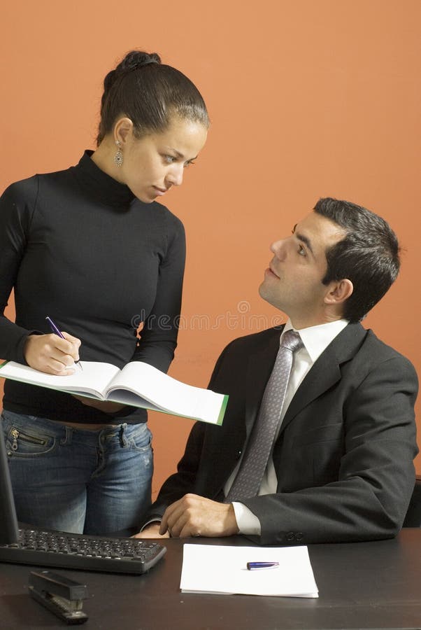 Woman Takes Notes for Business Man - Vertical Stock Photo - Image of ...