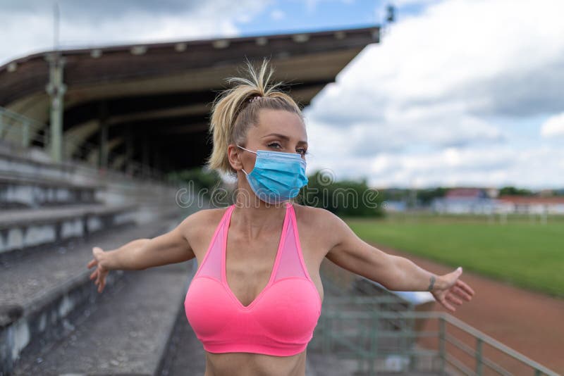 Woman Takes Off Medical Facemask After Outdoor Training Or Running