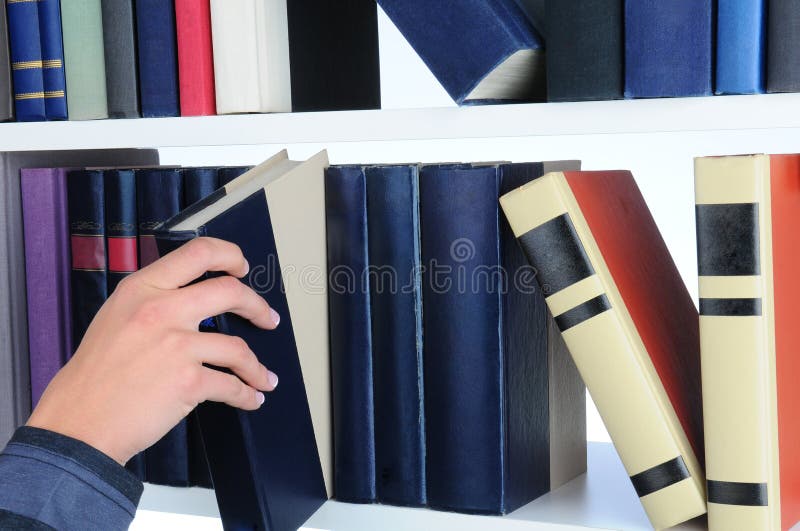 Hand Taking Book From The Shelf Stock Image - Image of book, concept ...