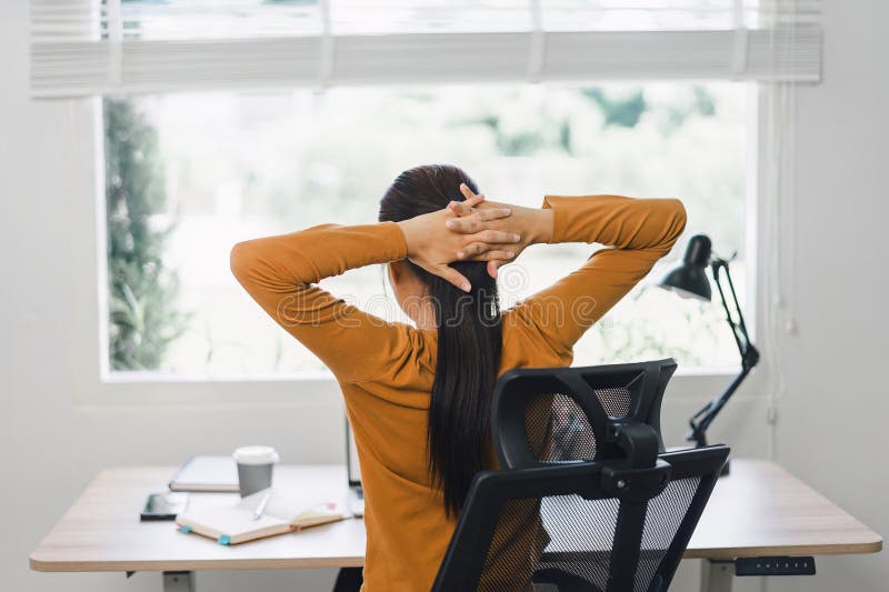 Woman Taking a Break and Stretching at Desk in Home Office. Stock Photo ...