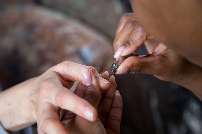 Woman Taking Care of Her Nails with a Manicure Service. Hands of a ...