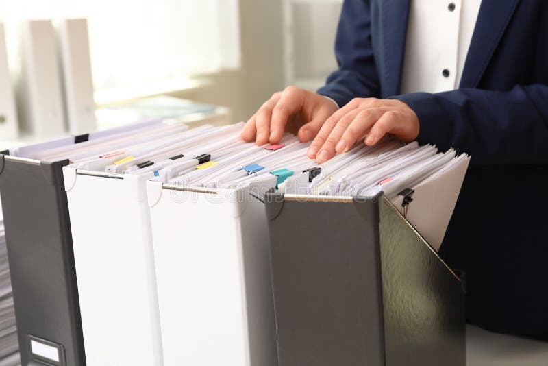 Woman Taking Documents from Folder in Archive Stock Image - Image of ...