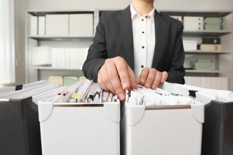Woman Taking Documents from Folder in Archive Stock Photo - Image of ...
