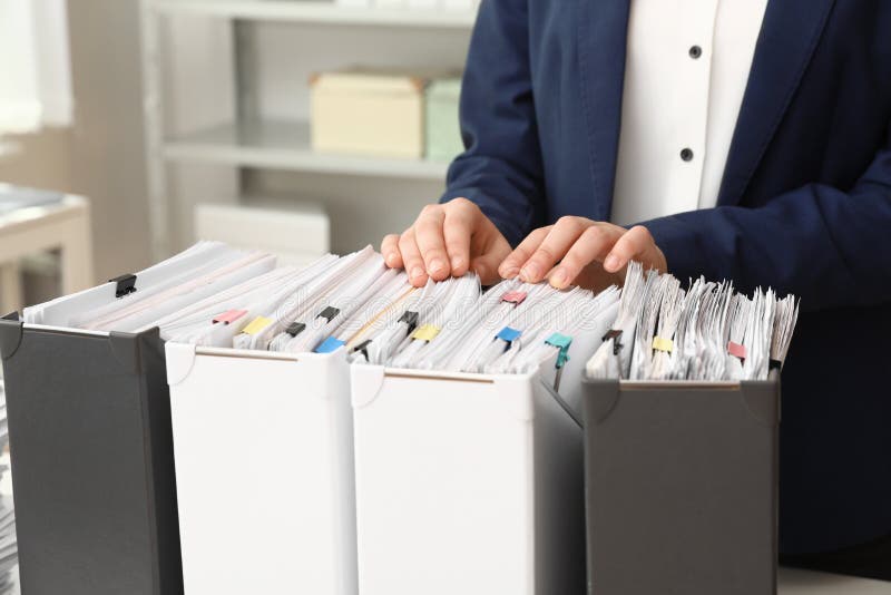 Woman Taking Documents from Folder in Archive Stock Image - Image of ...