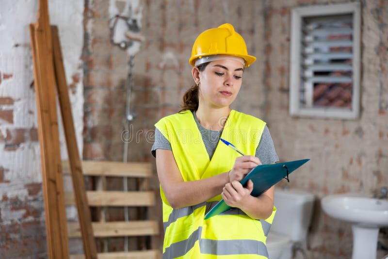Woman Taking Notes on Indoor Construction Site Stock Photo - Image of ...