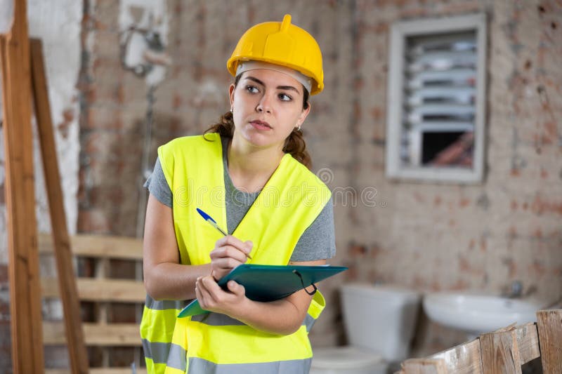 Woman Taking Notes on Indoor Construction Site Stock Photo - Image of ...