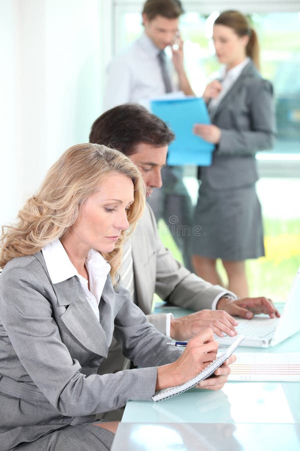 Woman Taking Notes in a Meeting Stock Photo - Image of brainstorming ...