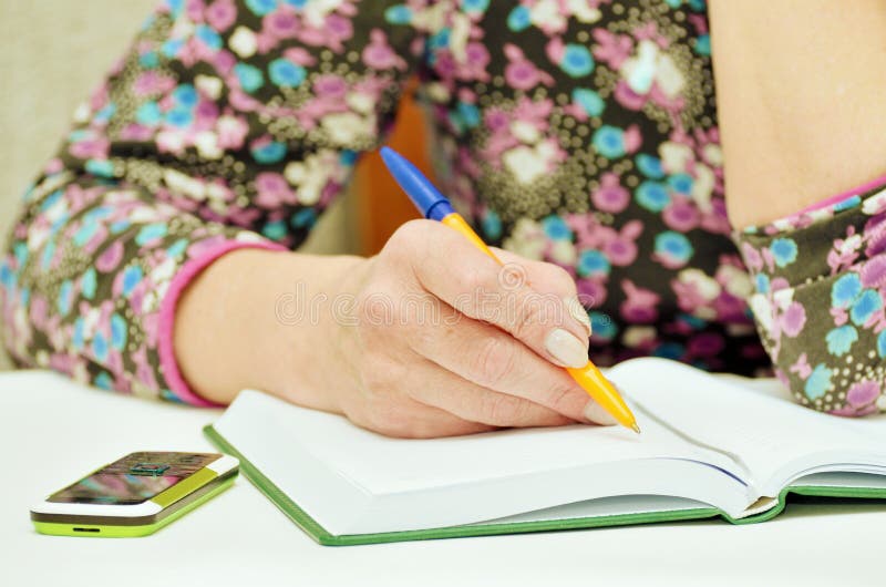 Woman Taking Notes in Notepad. Stock Photo - Image of attention, diary ...