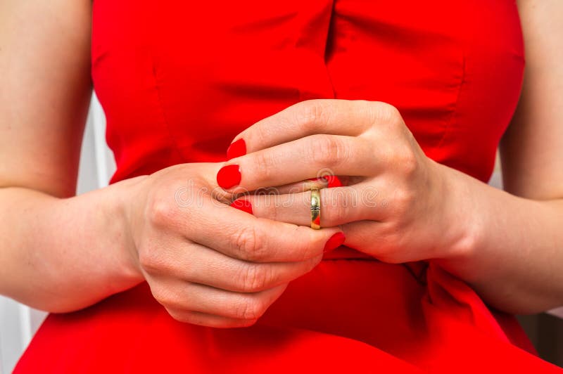 Woman is Taking Off Her Wedding Ring - Divorce Concept Stock Photo ...
