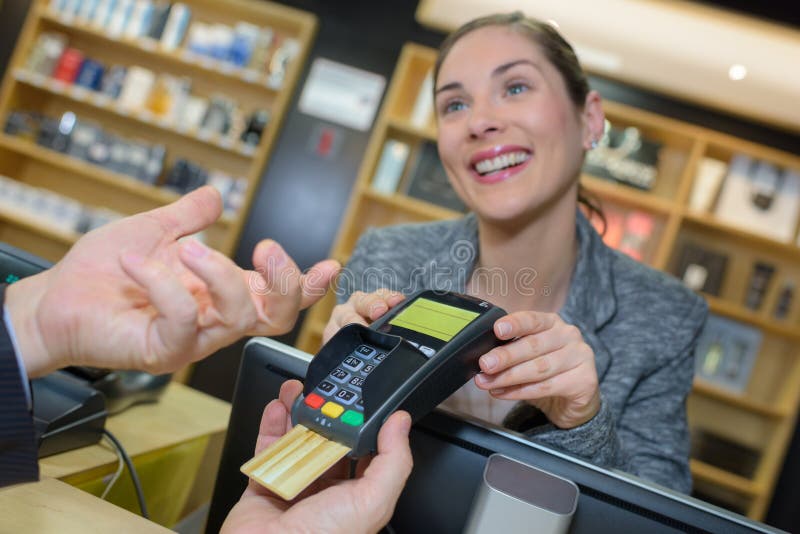 Woman Taking Payment from Man Stock Image - Image of debit, hold: 120353821