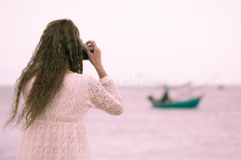 Woman Taking Photo on Beach Stock Image - Image of female, asian: 45740967