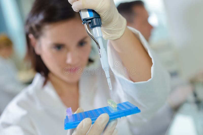 Woman Taking Samples from Pipette Stock Photo - Image of hand, medicine ...